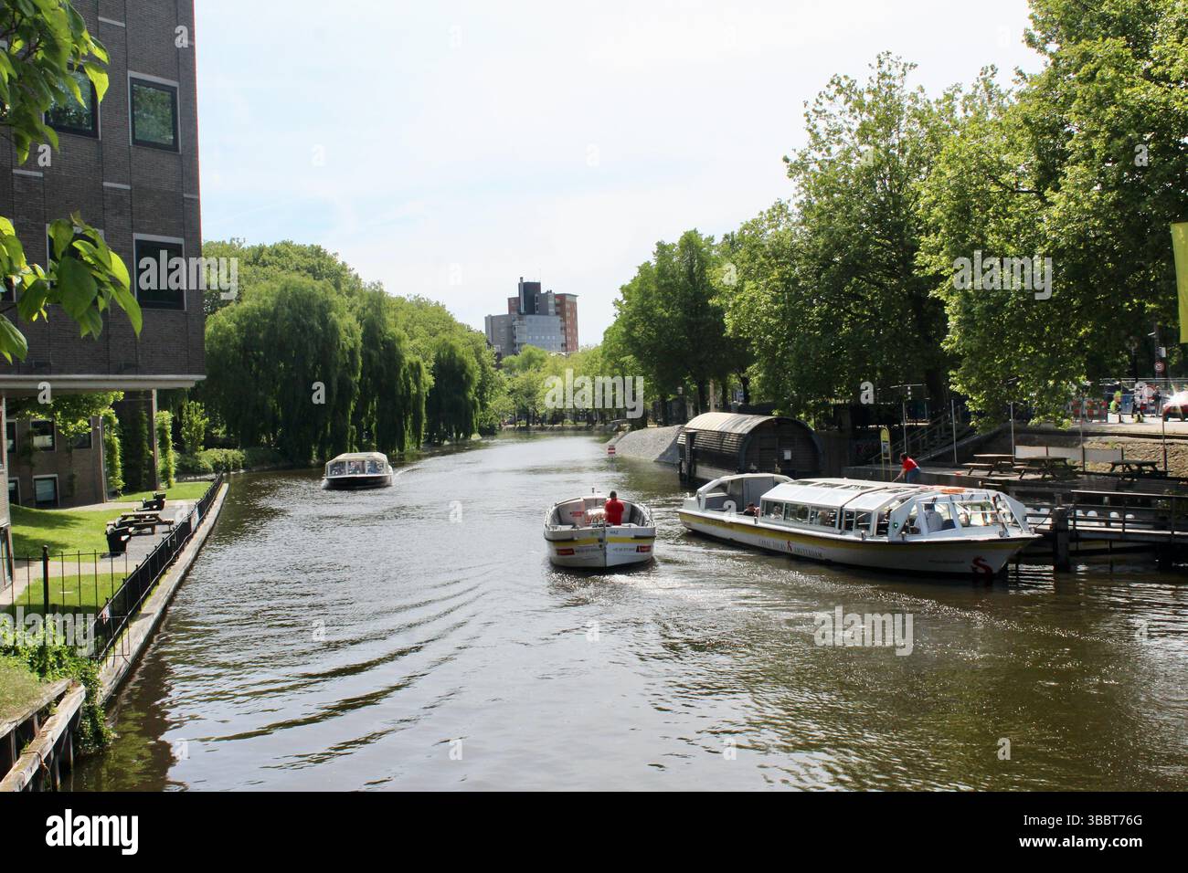 amsterdam the netherlands- canal traffic with barges and boats Stock ...