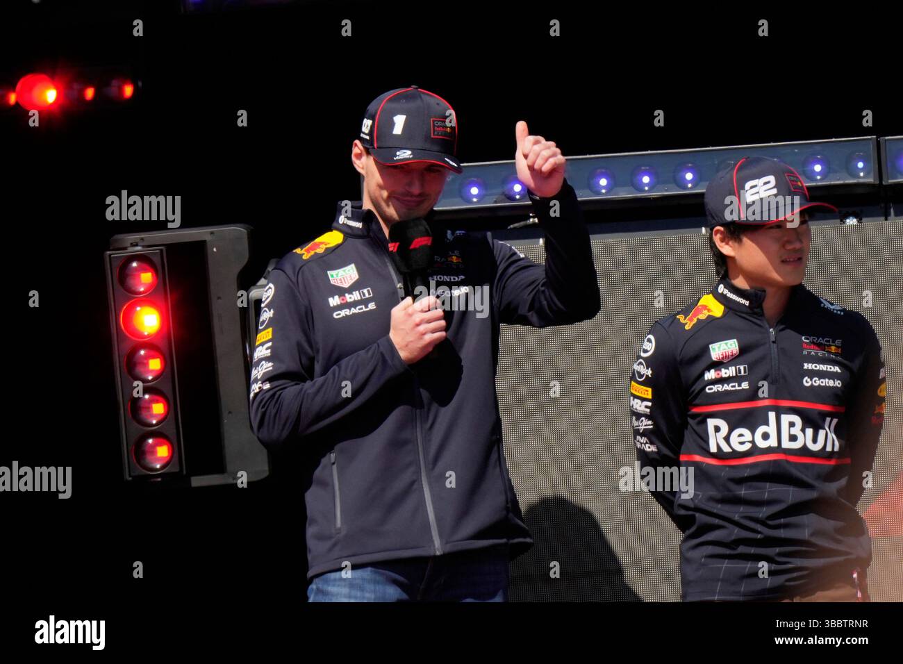 Red Bull driver Max Verstappen, left, of the Netherlands, smiles with ...
