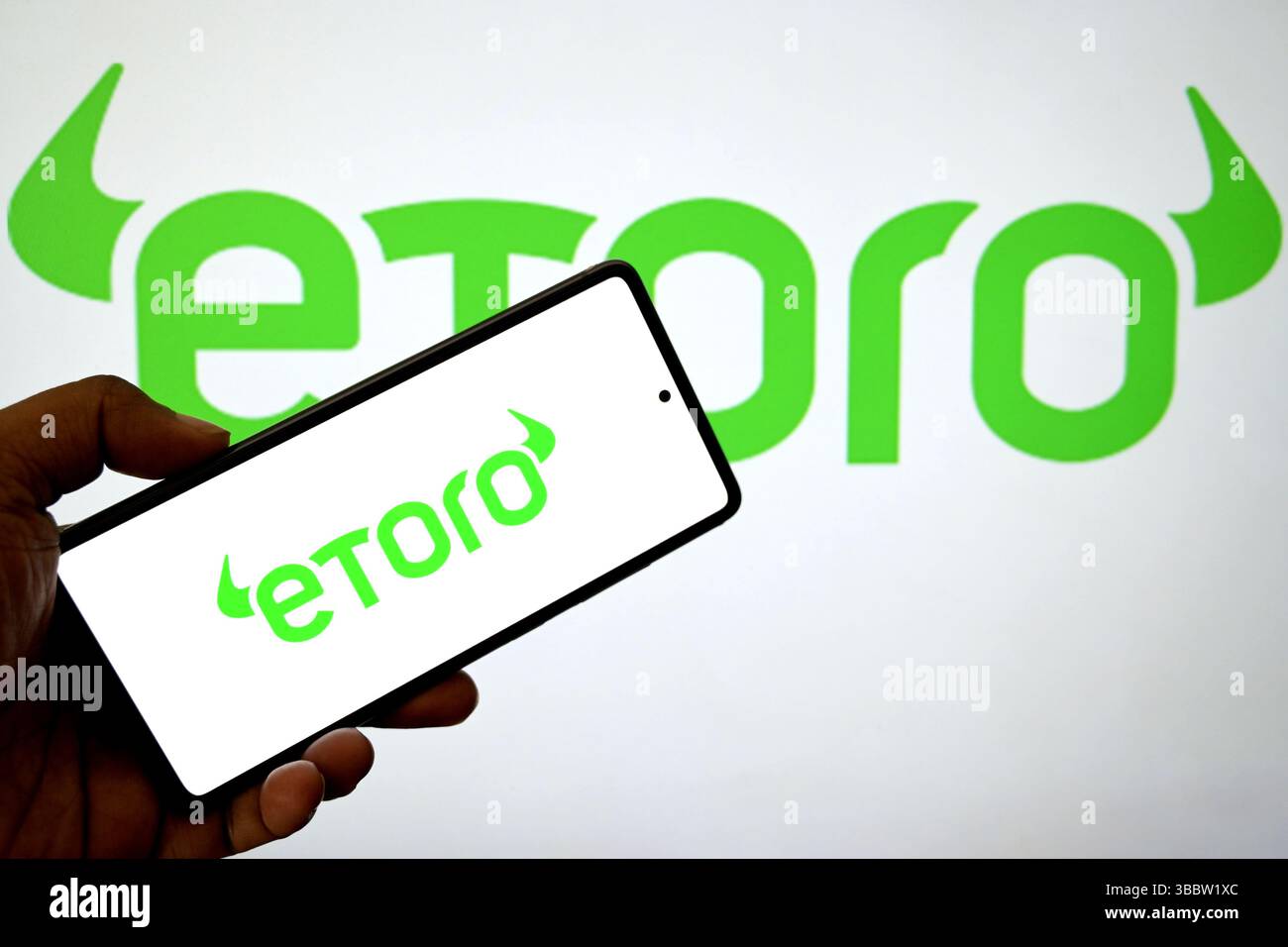 In this photo illustration, an eToro logo is seen displayed on a ...