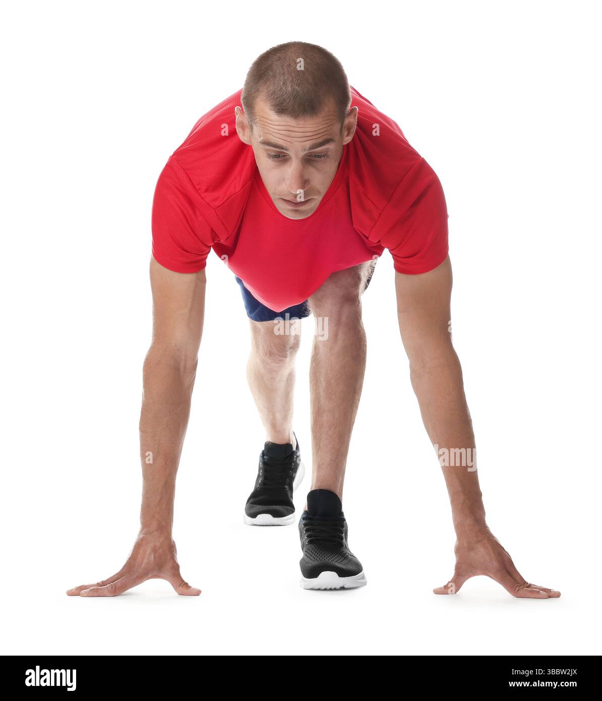 Runner in starting position on white background Stock Photo - Alamy