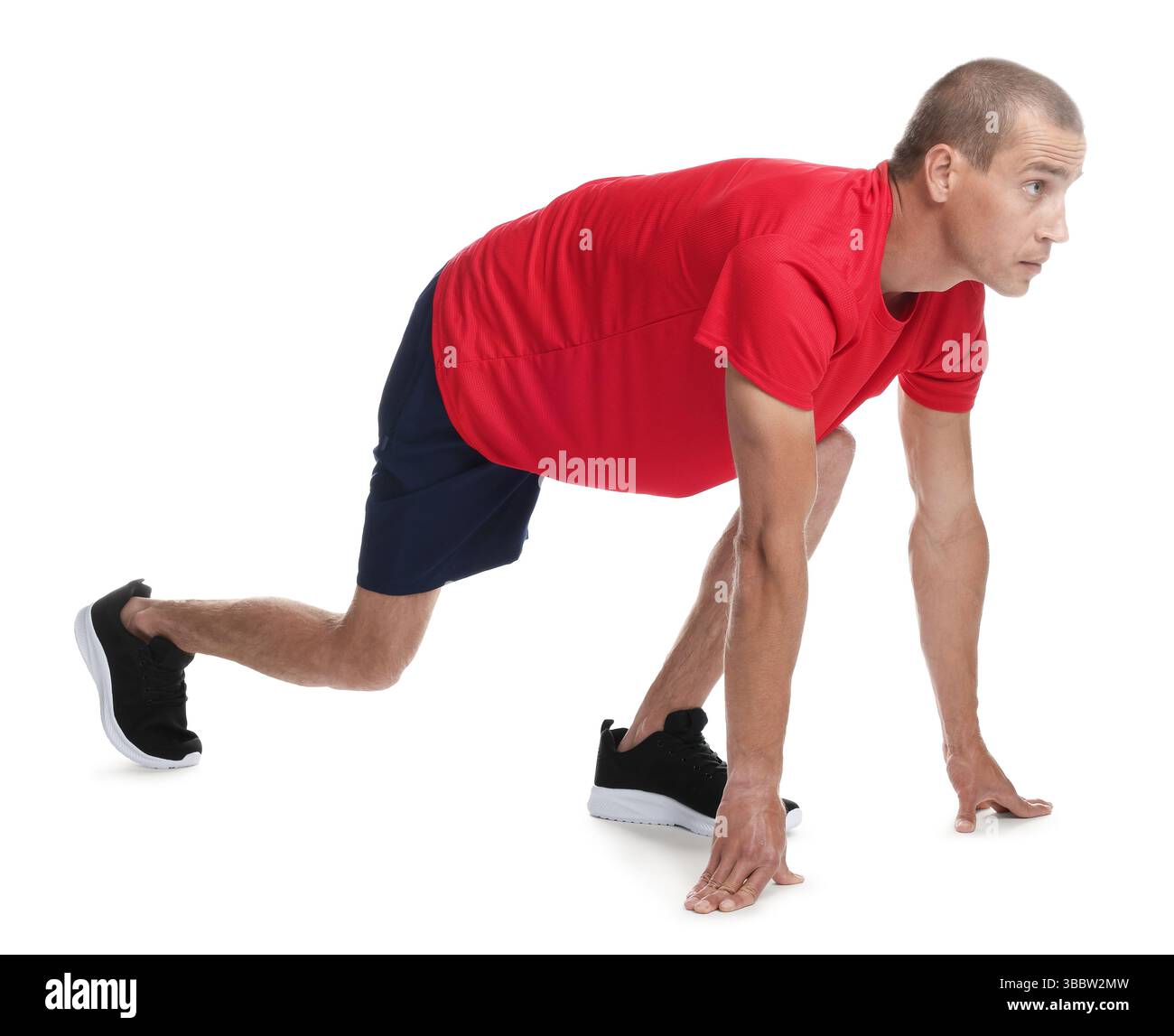 Runner in starting position on white background Stock Photo - Alamy