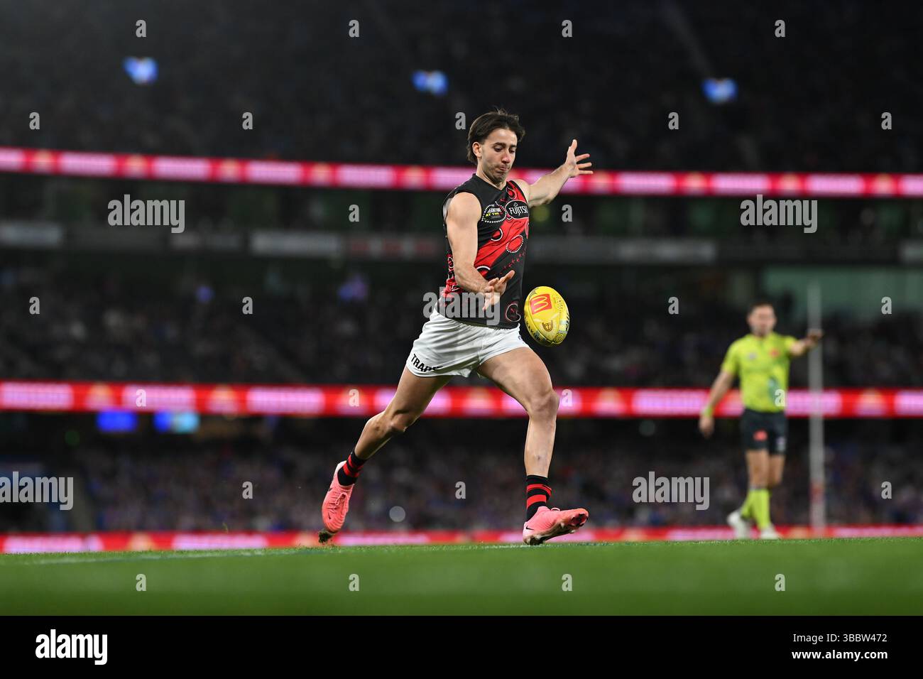 Melbourne, Australia. 17th May, 2025. Nic Martin of Essendon kicks the ...