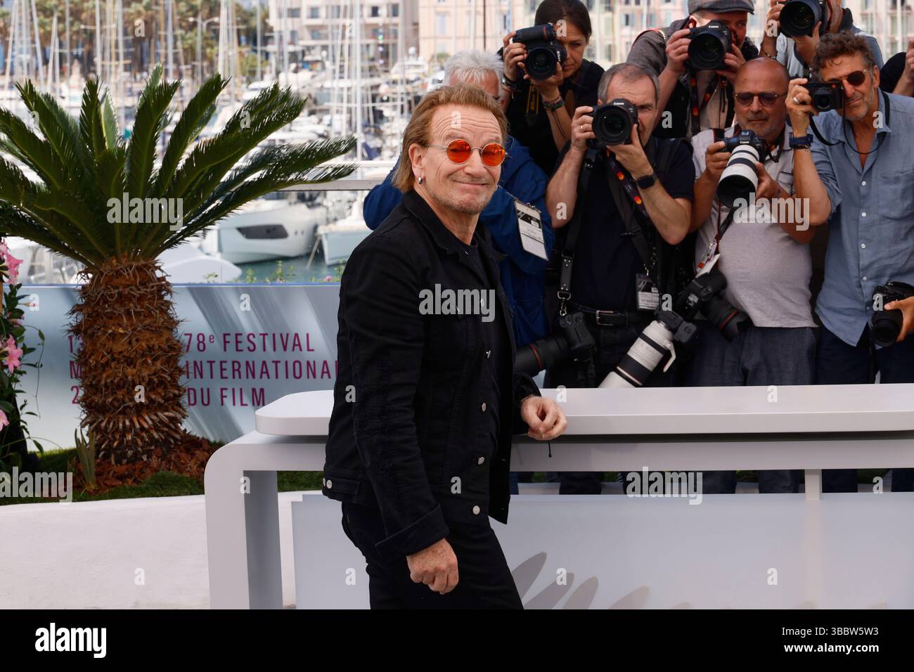 Bono poses for photographers at the photo call for the film 'Bono ...