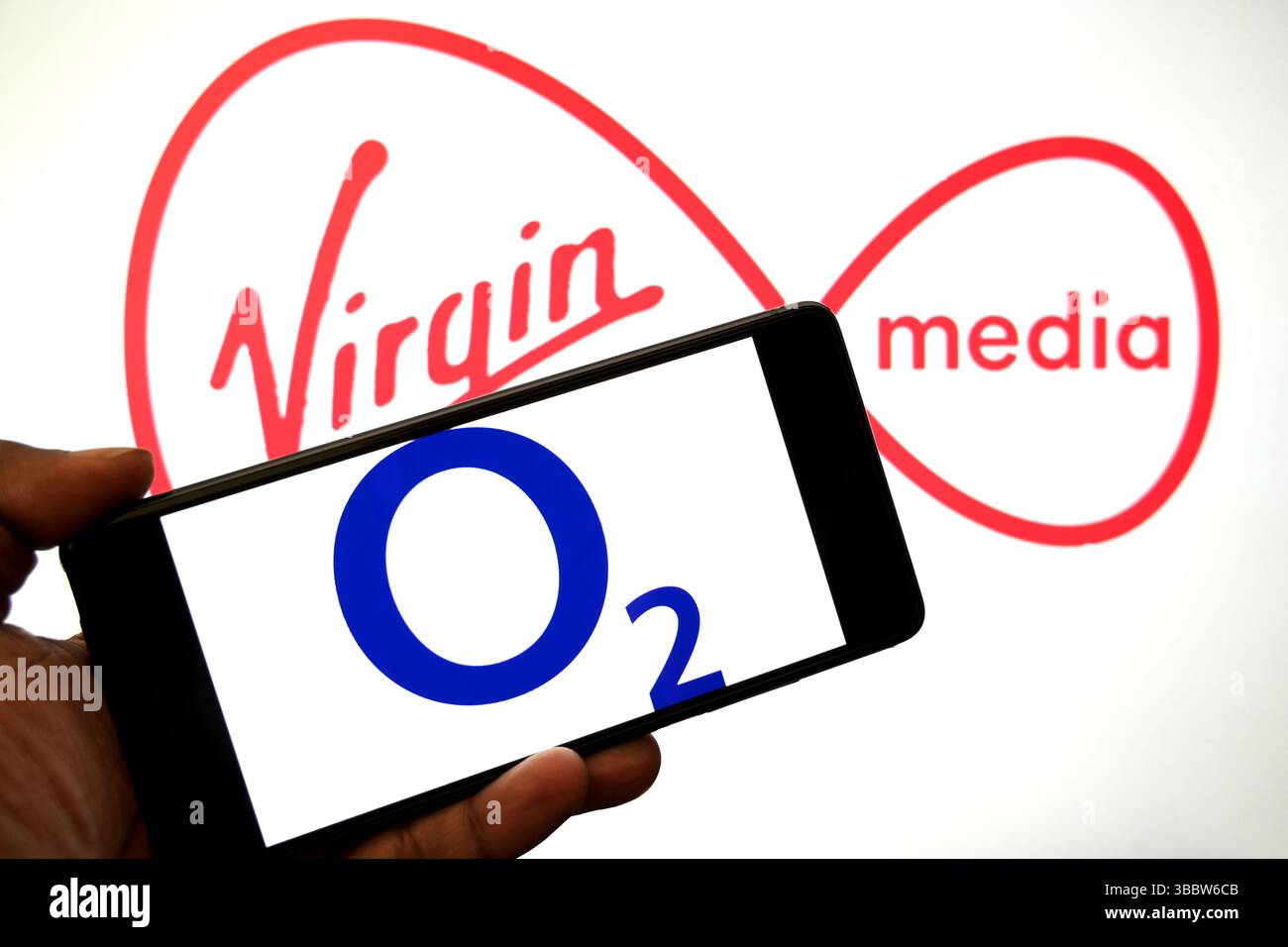 In this photo illustration, an O2 logo is seen displayed on a ...