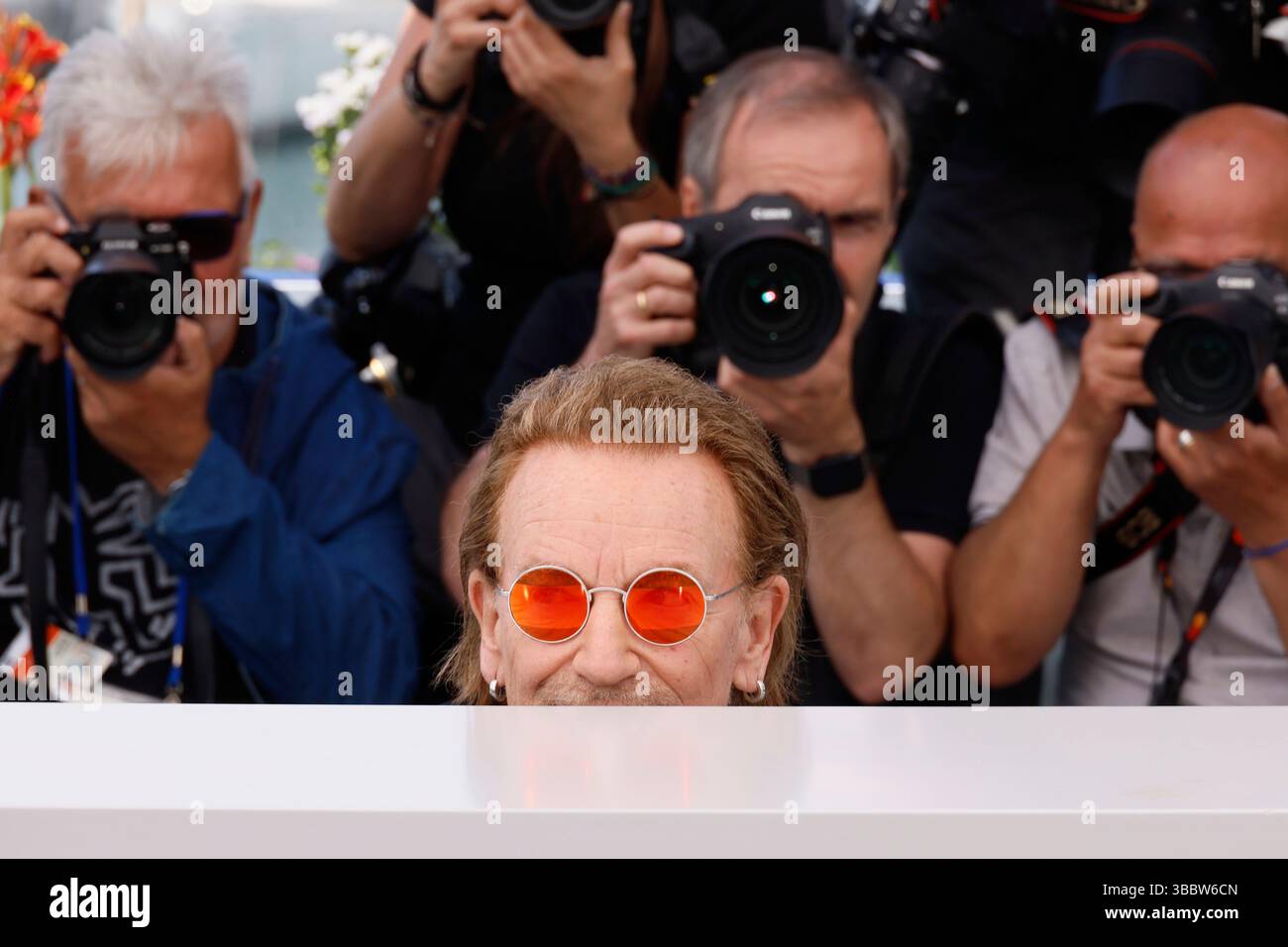 Bono poses for photographers at the photo call for the film 'Bono ...