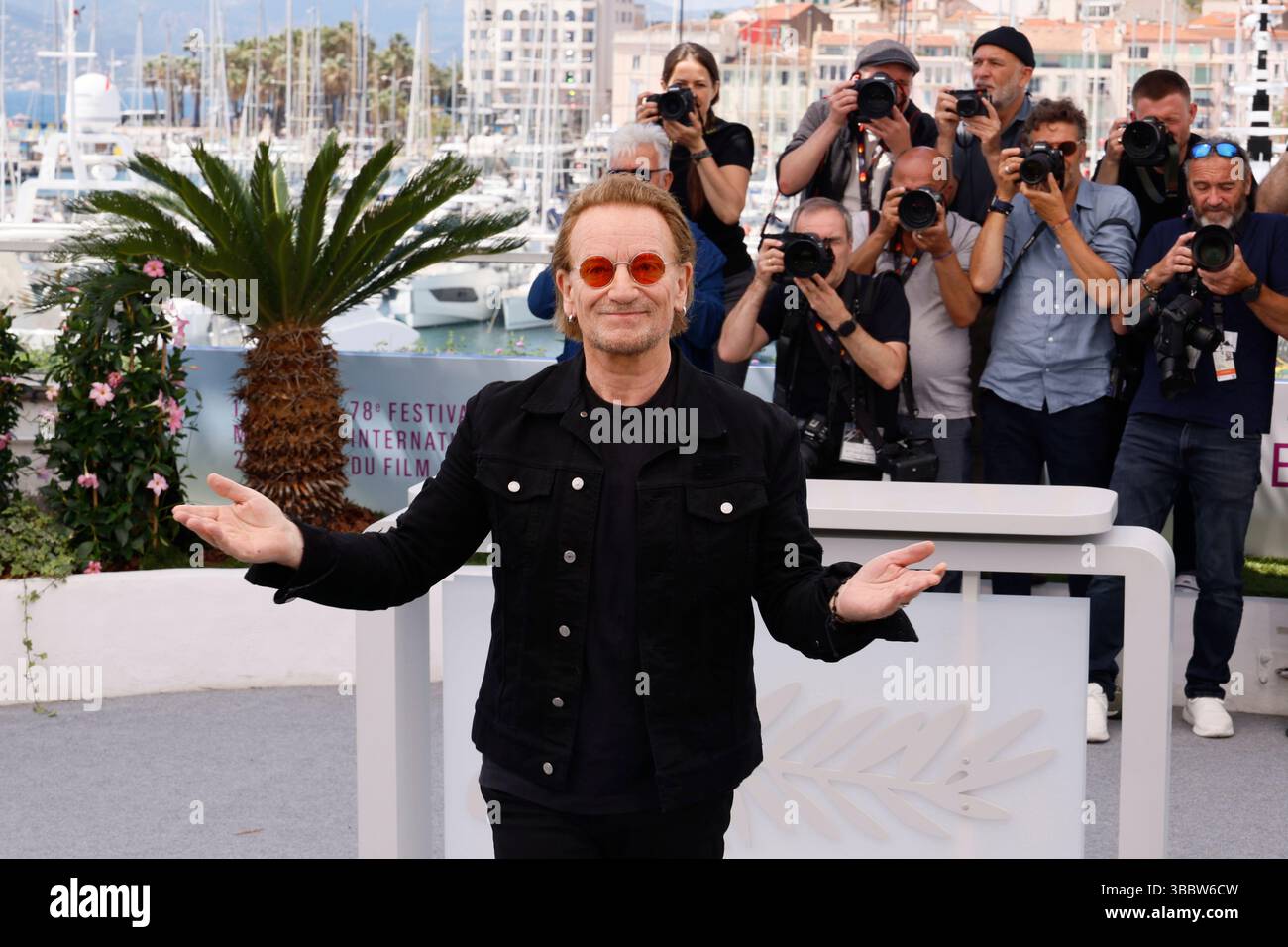 Bono poses for photographers at the photo call for the film 'Bono ...