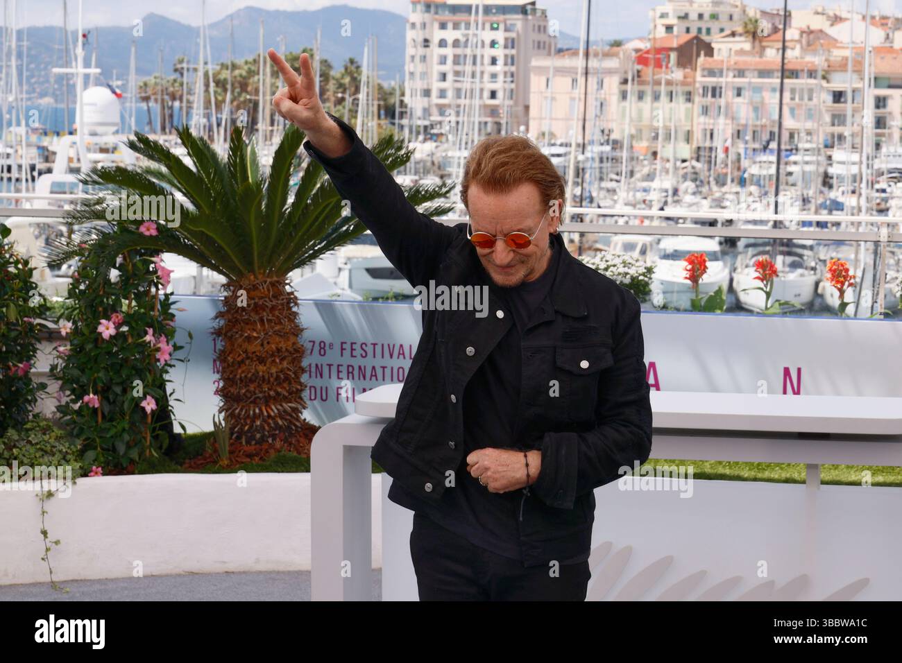 Bono poses for photographers at the photo call for the film 'Bono ...