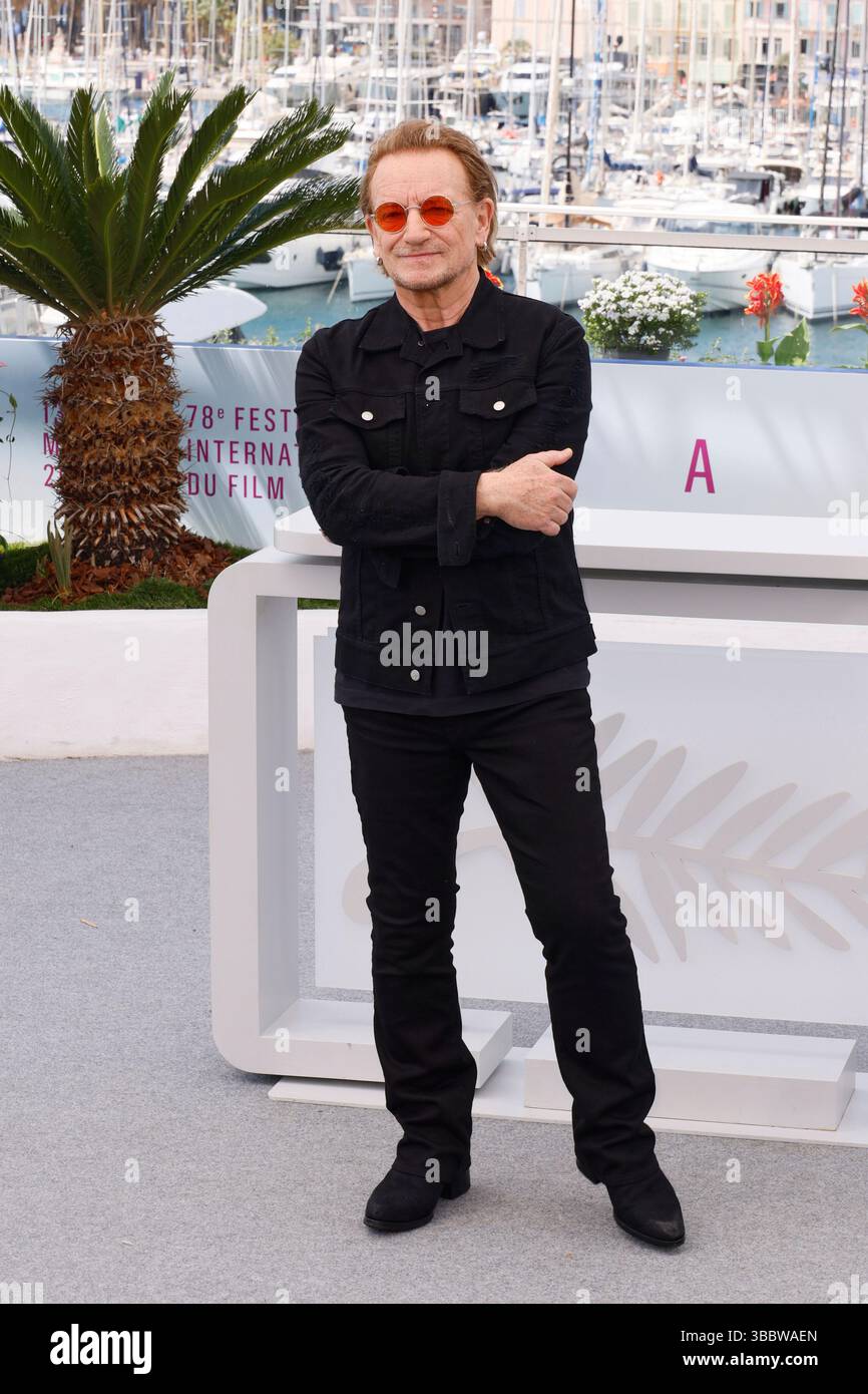 Bono poses for photographers at the photo call for the film 'Bono ...