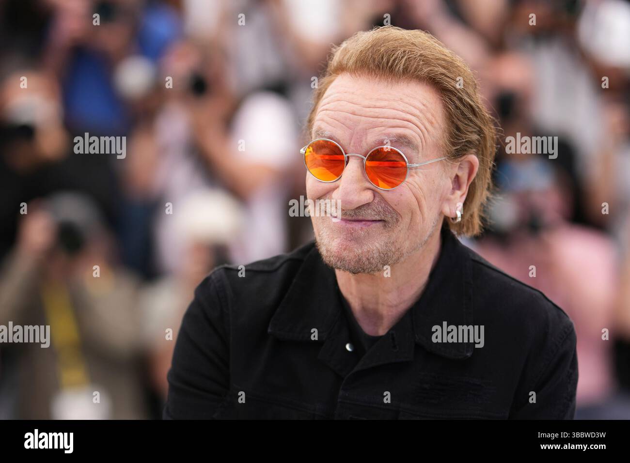 Bono poses for photographers at the photo call for the film 'Bono ...