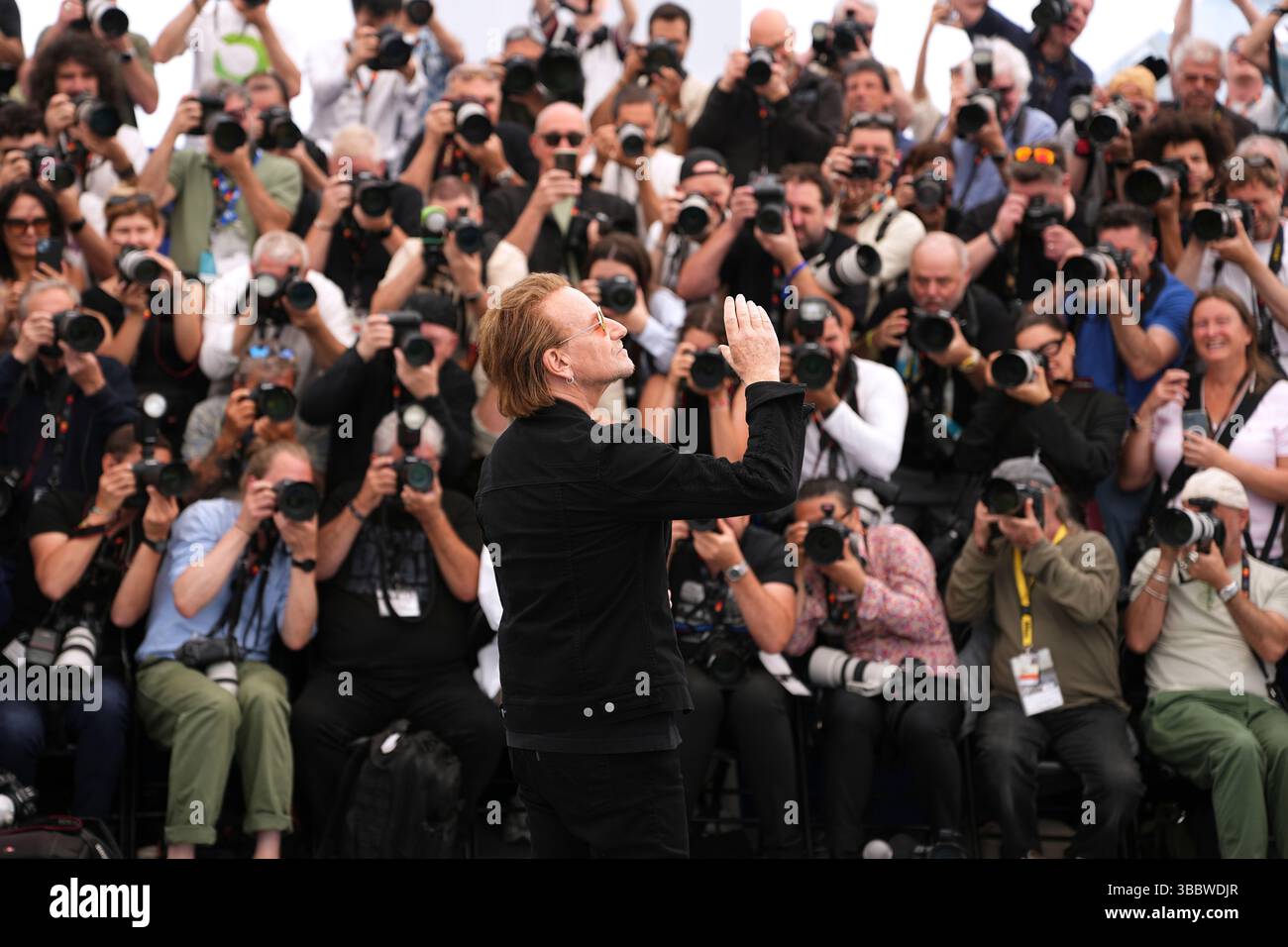 Bono poses for photographers at the photo call for the film 'Bono ...