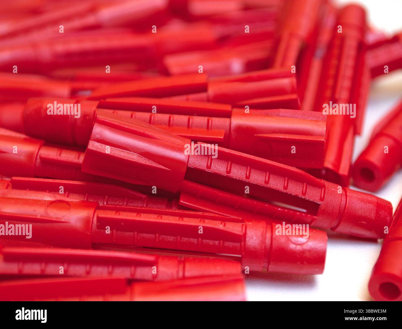 Plastic dowel in front of white background Stock Photo - Alamy