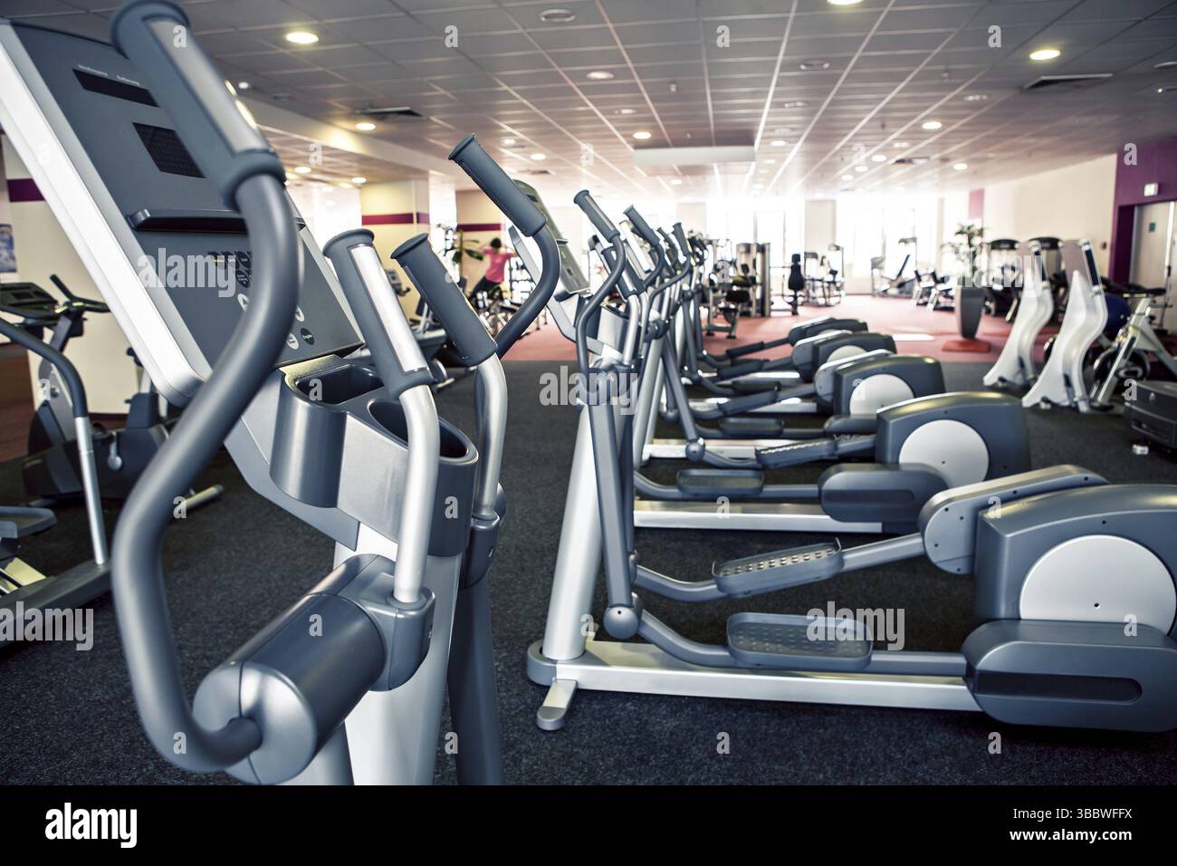 Diverse equipment and machines at the gym room Stock Photo - Alamy