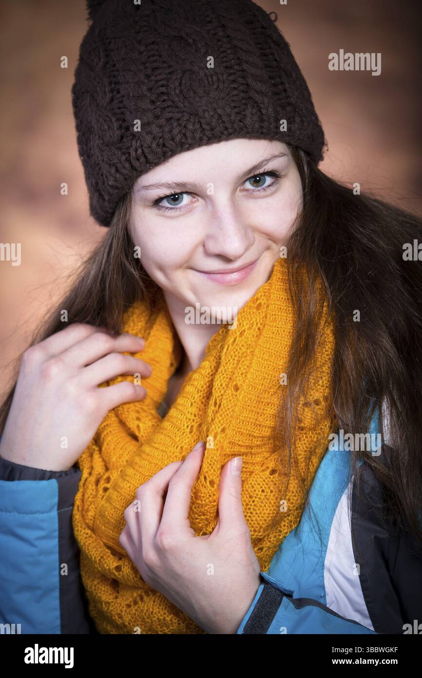 Studio portrait of a teenage girl with woollen clothes Stock Photo - Alamy