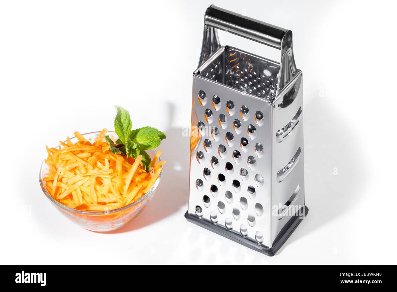 Metal grater for fruits and vegetables. Small holes and large ones. On ...