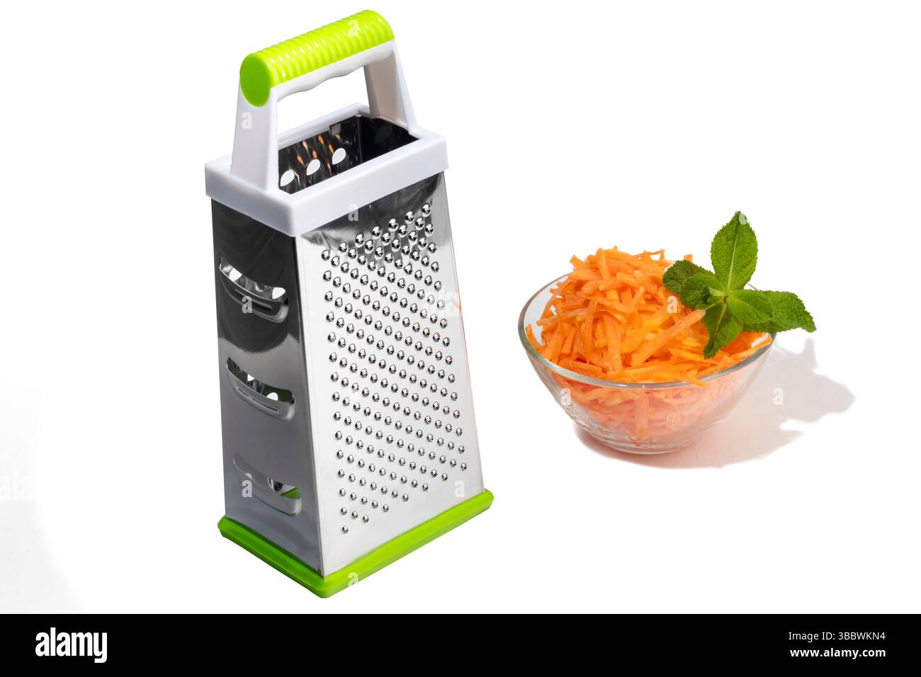 Metal grater for fruits and vegetables. Small holes and large ones. On ...
