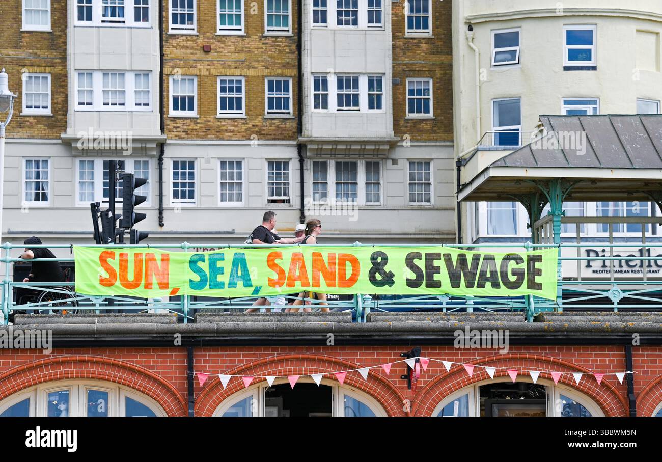 Brighton UK 17th May 2025 - A banner hung on the seafront as hundreds ...