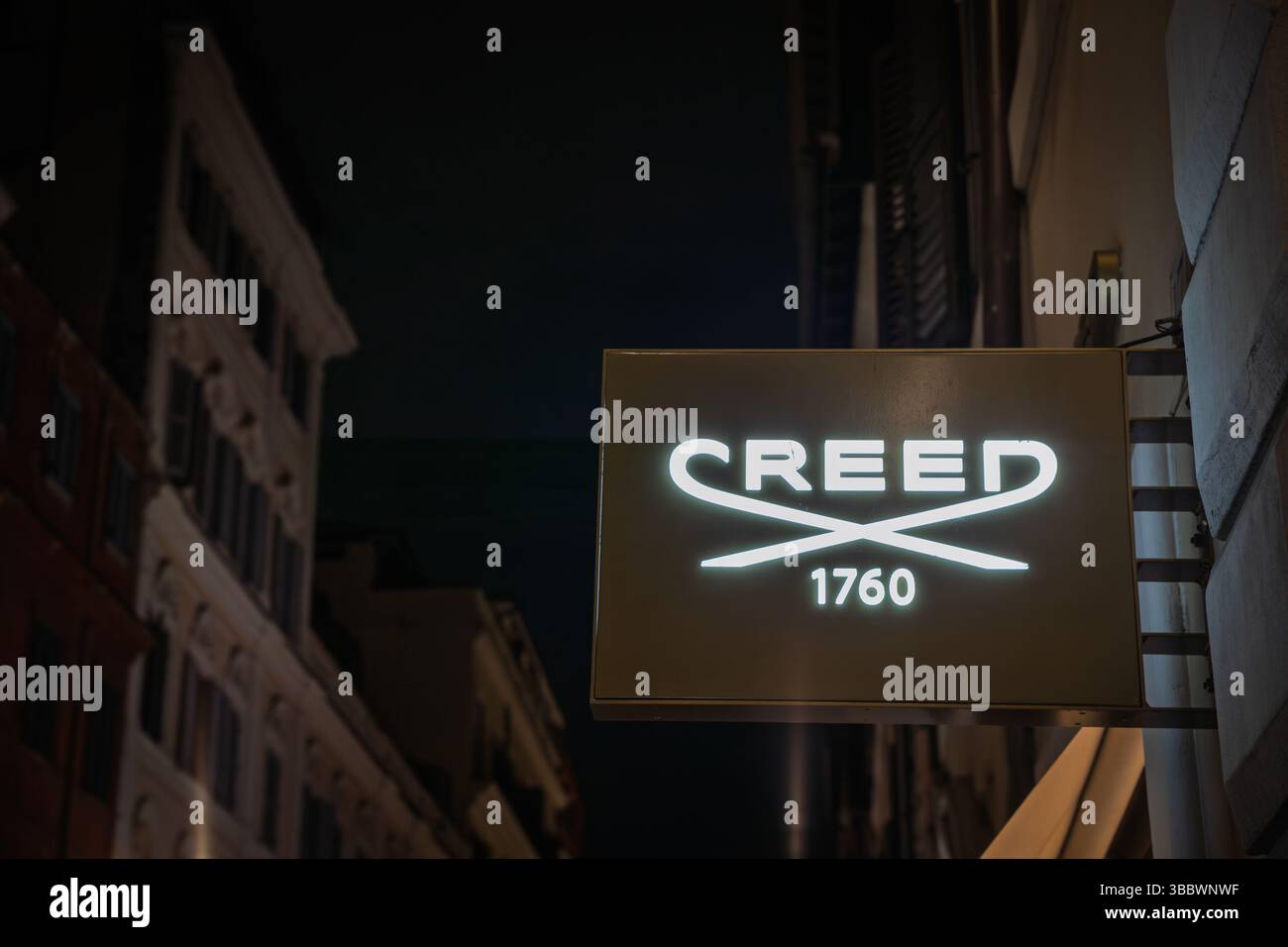 ROME, ITALY - JANUARY 15, 2025: Illuminated sign of luxury fragrance ...