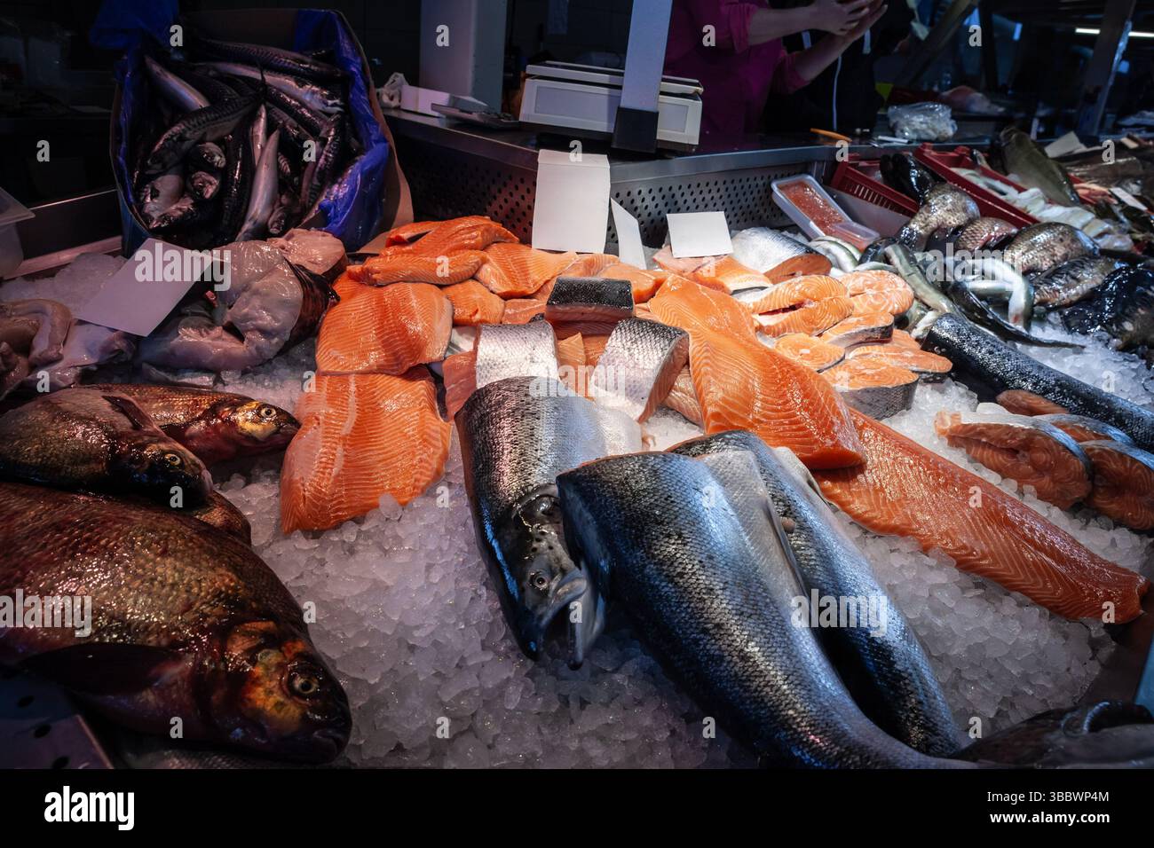 At Centraltirgus fish hall, bright orange Atlantic salmon fillets ...