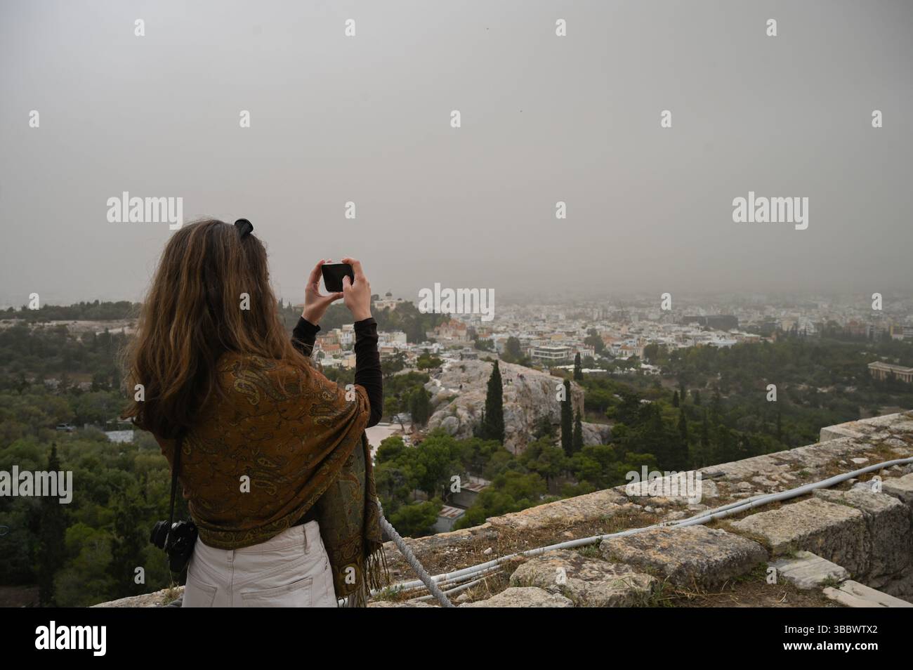Athens, Greece, 16 May 2025. A visitor takes pictures while Athens is ...
