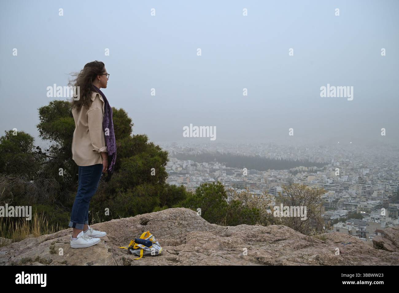 Athens, Greece, 16 May 2025. A woman looks over the city while Athens ...