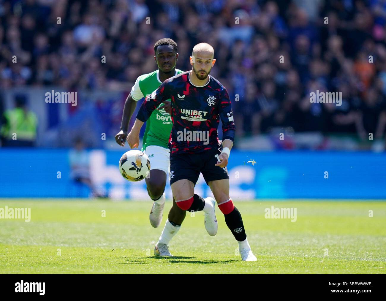 Hibernian's Alasana Manneh (left) and Rangers' Vaclav Cerny battle for ...