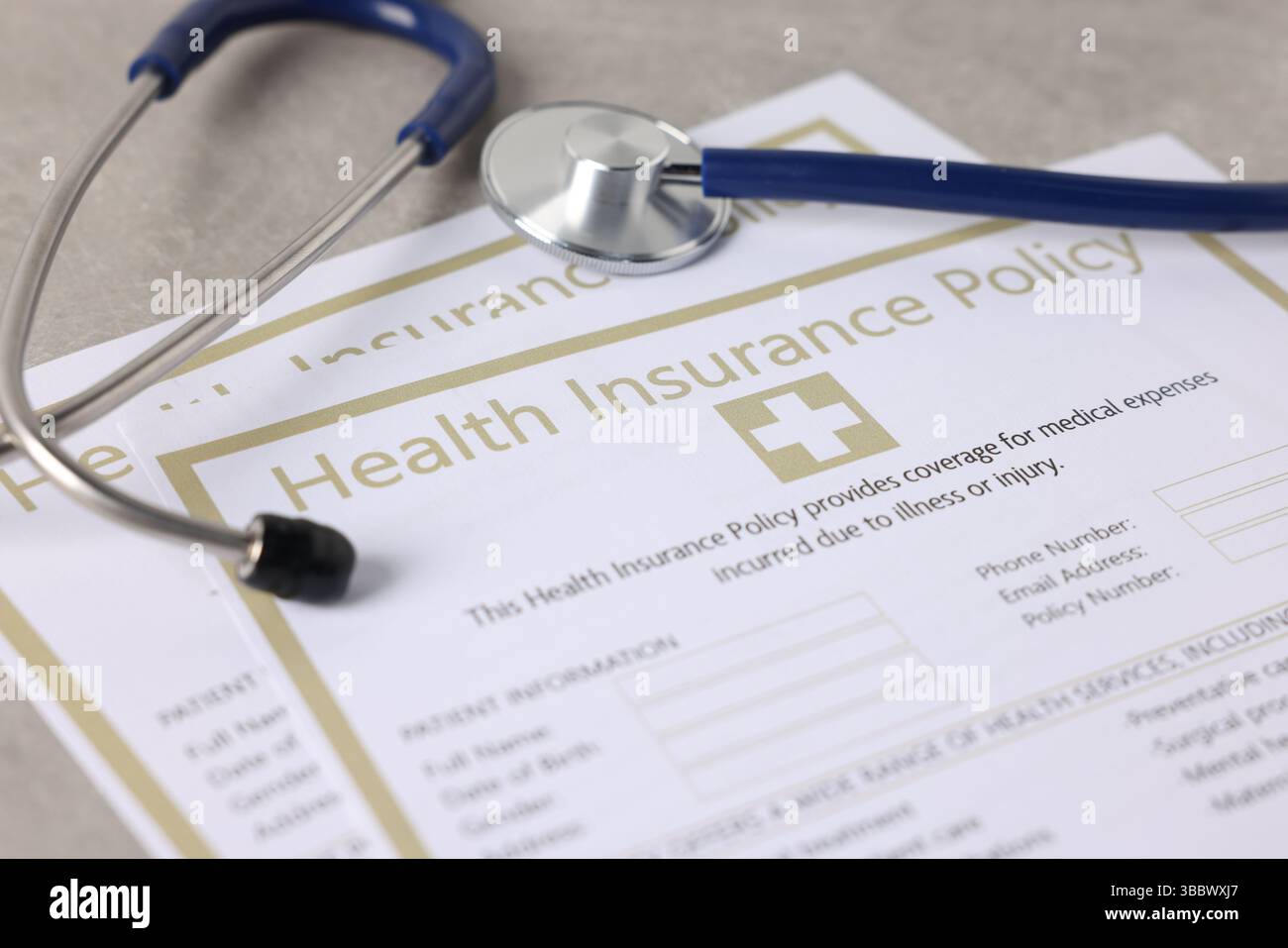 Health insurance policy forms and stethoscope on grey table, closeup ...