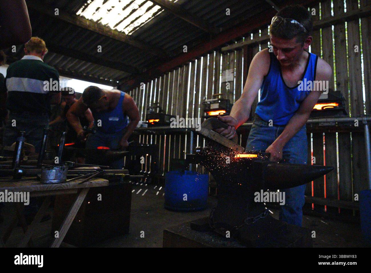 Apprentice farriers take part in a horse show making competition during ...