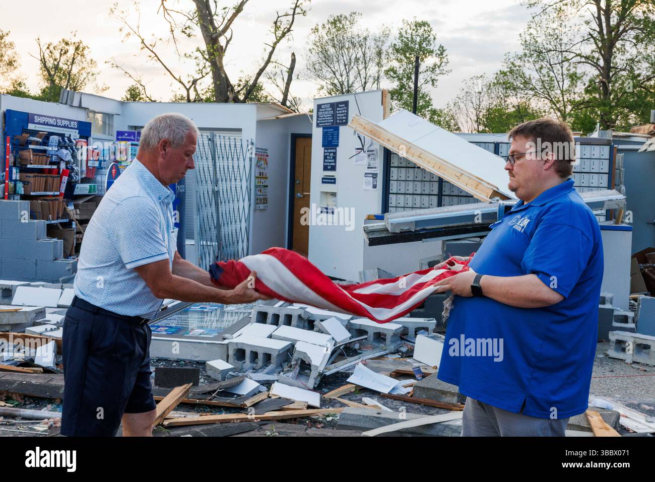 Bloomington, United States. 16th May, 2025. Men fold the American flag ...