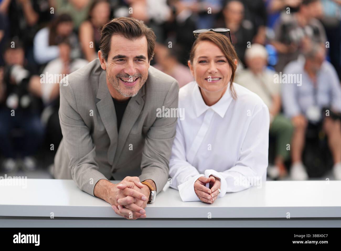 Claes Bang, left, and Sidse Babett Knudsen pose for photographers at ...