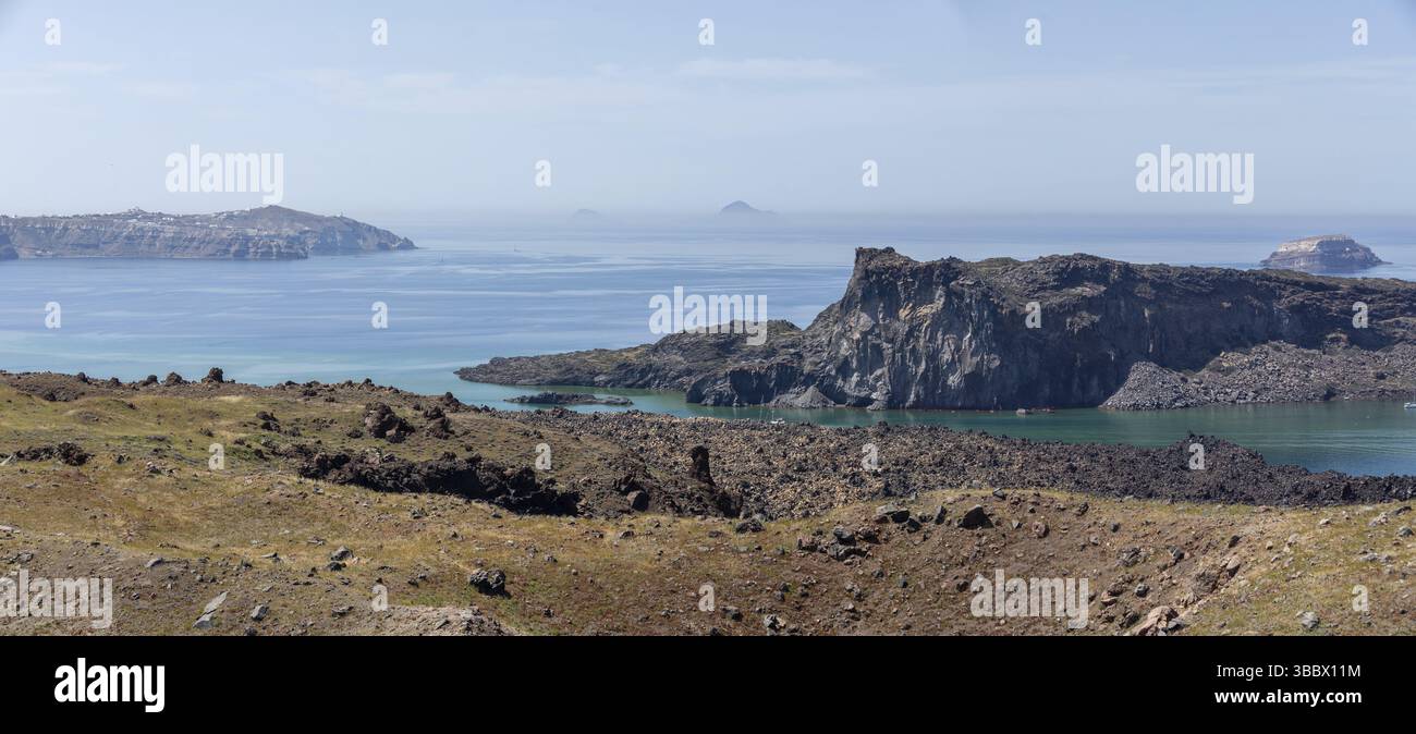 View from the volcanic island of Nea Kameni to the volcanic island of ...