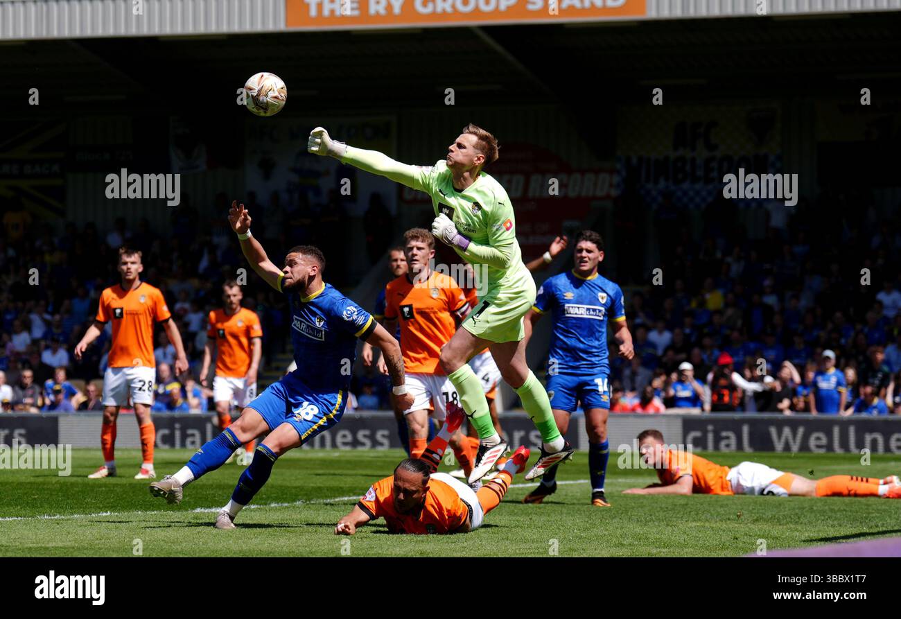 Notts County goalkeeper Alex Bass punches the ball clear during the Sky ...