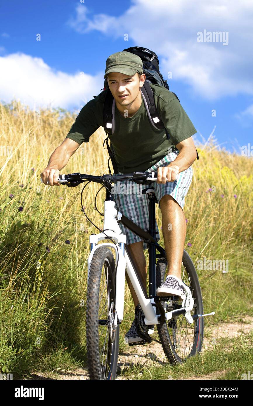 A biking man in front of nature scenes Stock Photo - Alamy