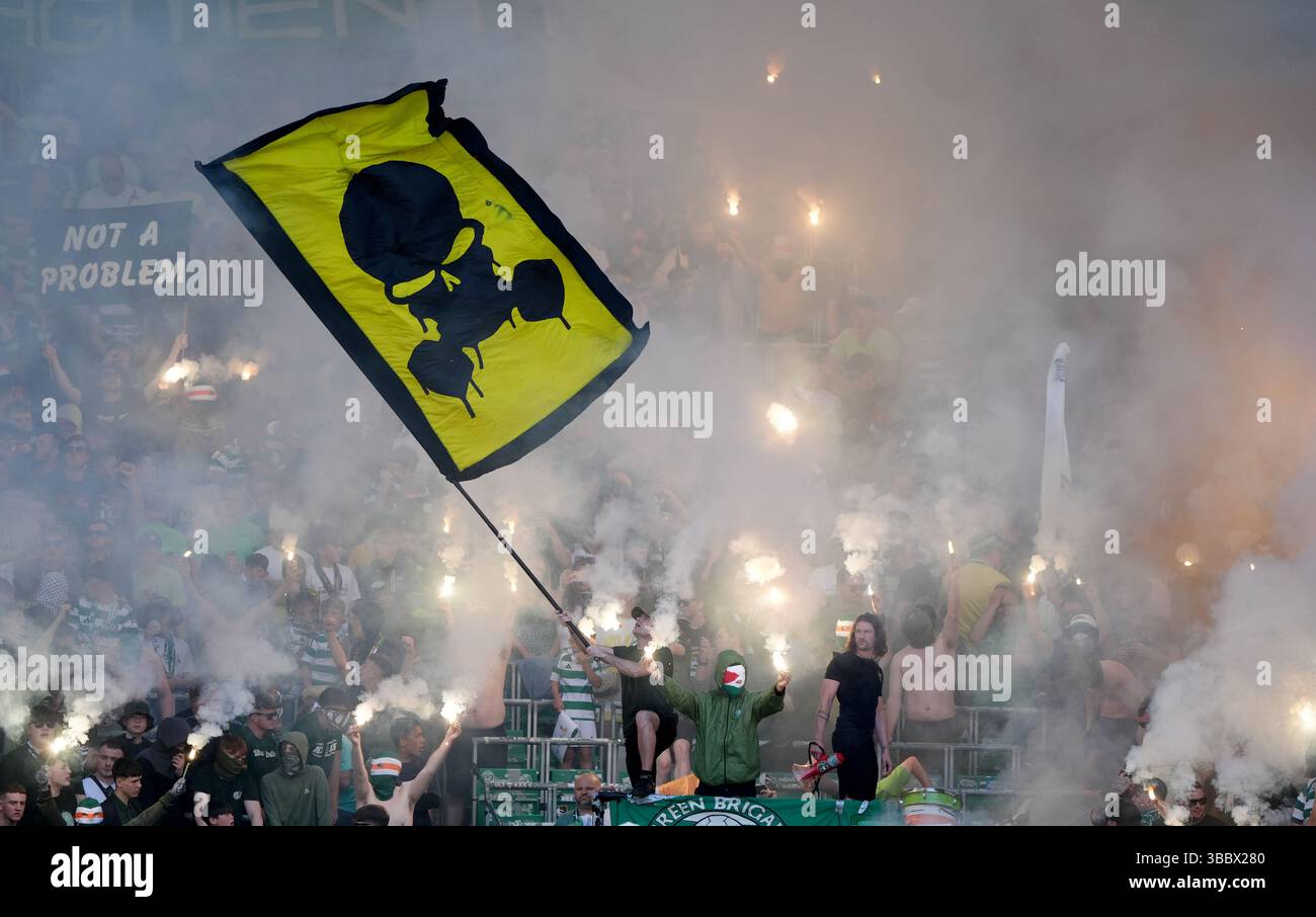 Celtic fans hold flares and flags, before the William Hill Premiership ...