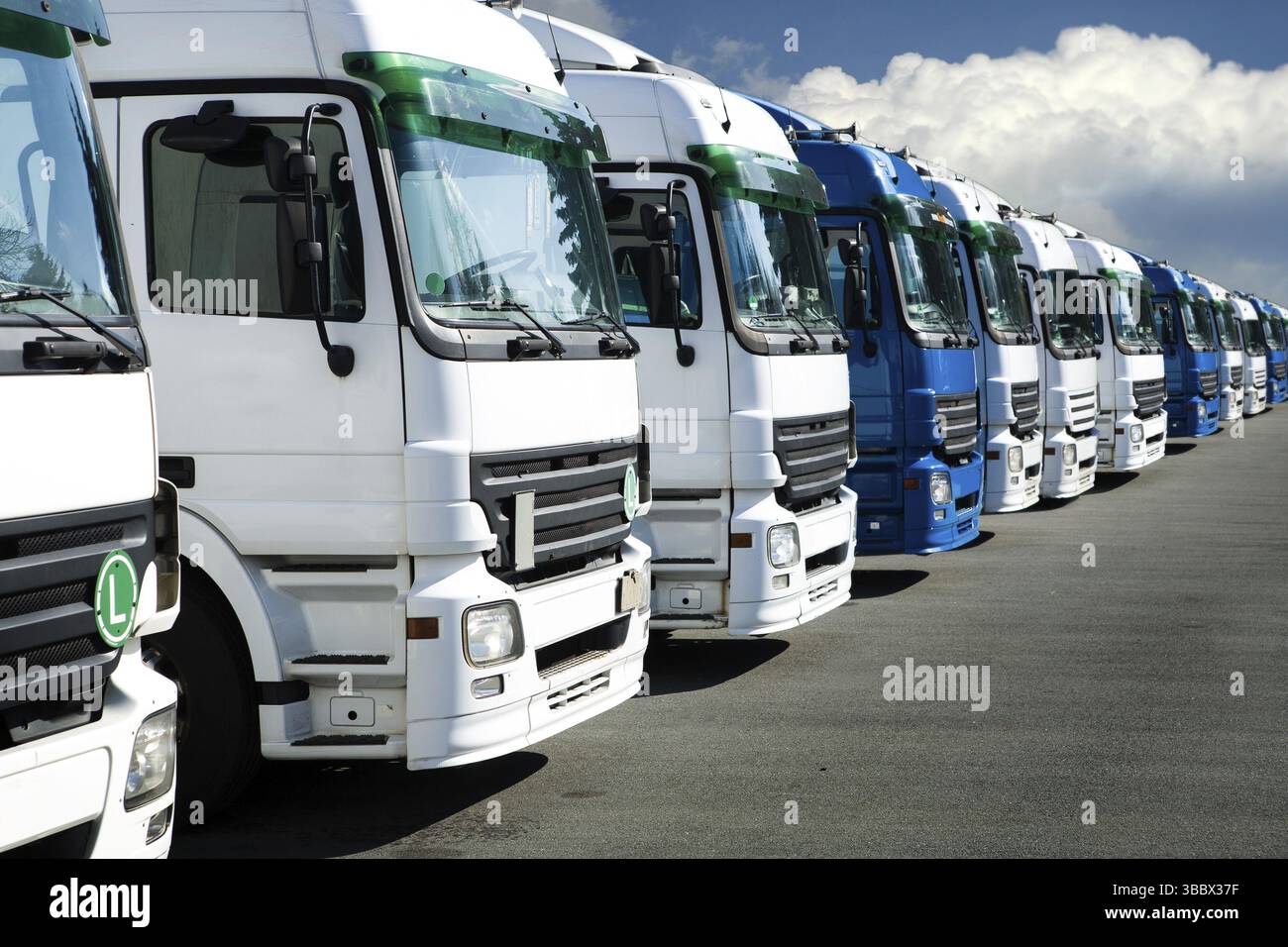 A line of trucks in the car park Stock Photo - Alamy