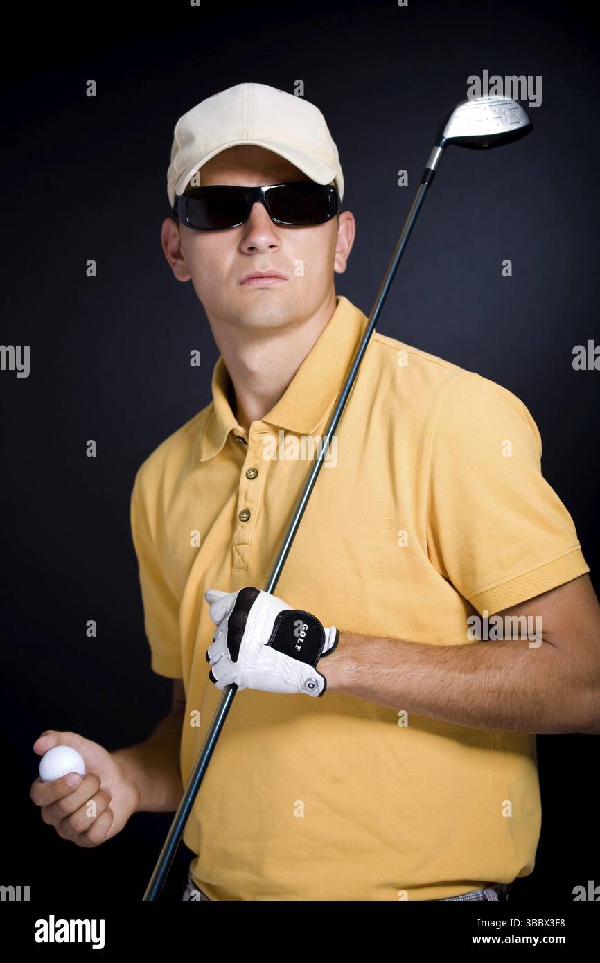 The male golf player with a driver Stock Photo - Alamy