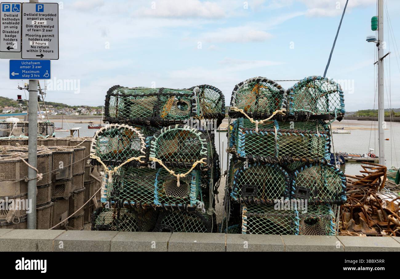 Crab traps stacked on a Harbor. Pile of lobster pots, sea side fishing ...