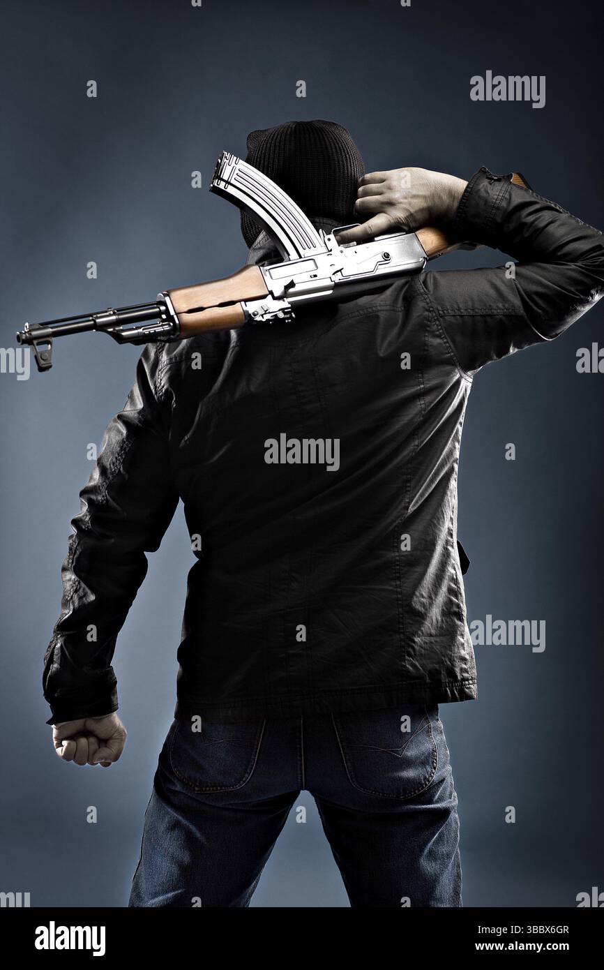 Masked terrorist with a kalashnikov submachine gun Stock Photo - Alamy