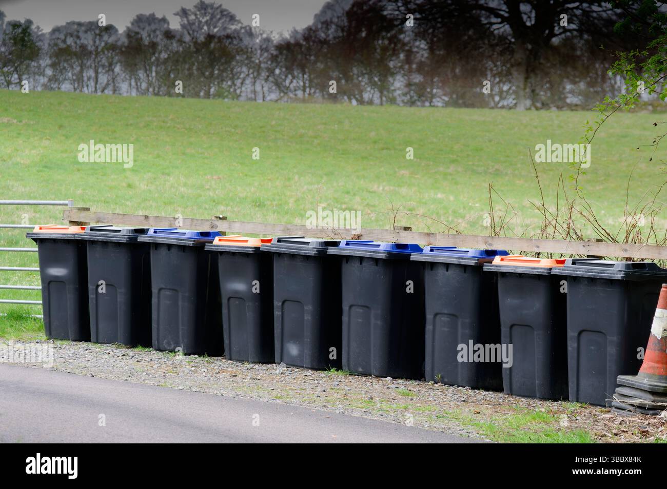 Wheelie bins in row for refuge collection outdoors Stock Photo - Alamy