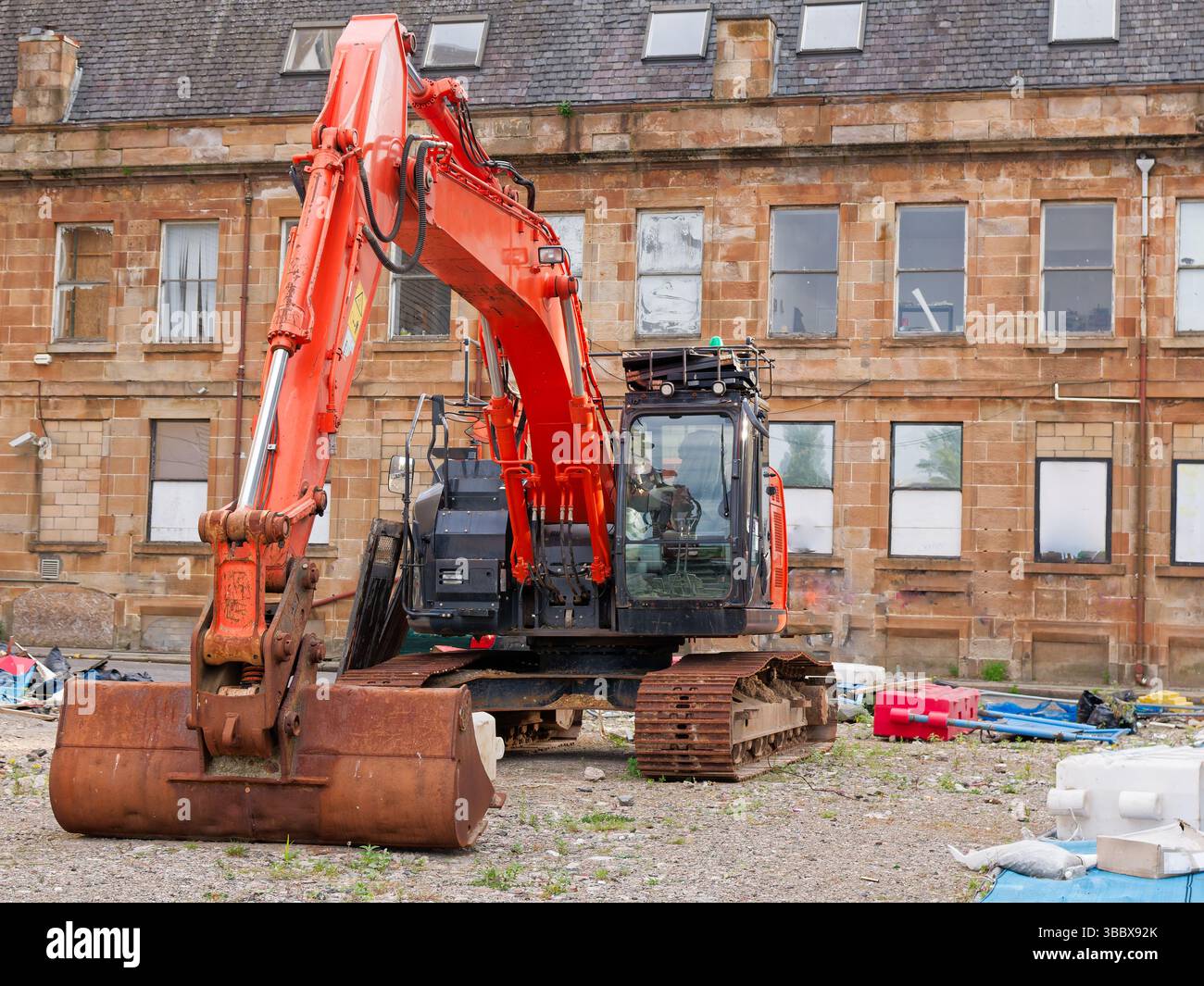 Construction site digger during excavation on building site in city ...