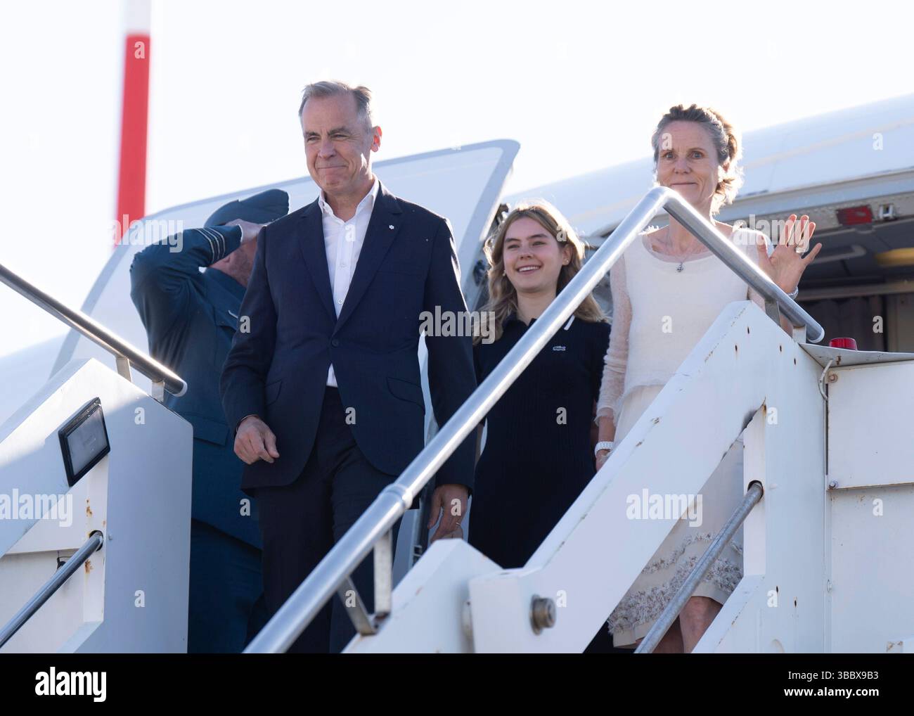 Prime Minister Mark Carney disembarks a government plane with daughter ...