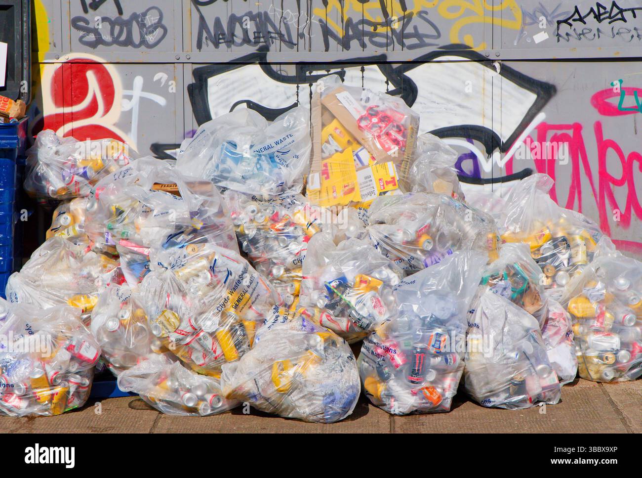 Black plastic bin bags full and left on street during bin collection ...