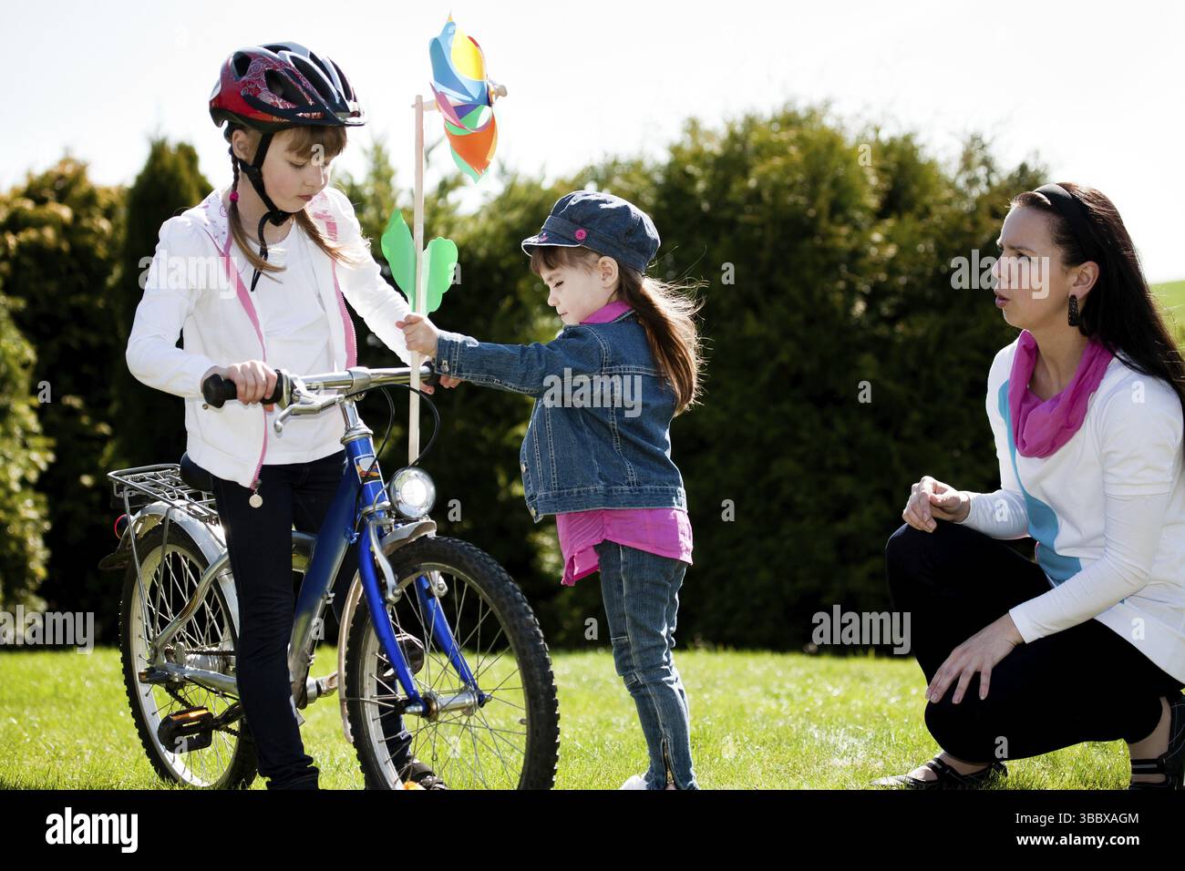 Little girl biking in the park Stock Photo - Alamy