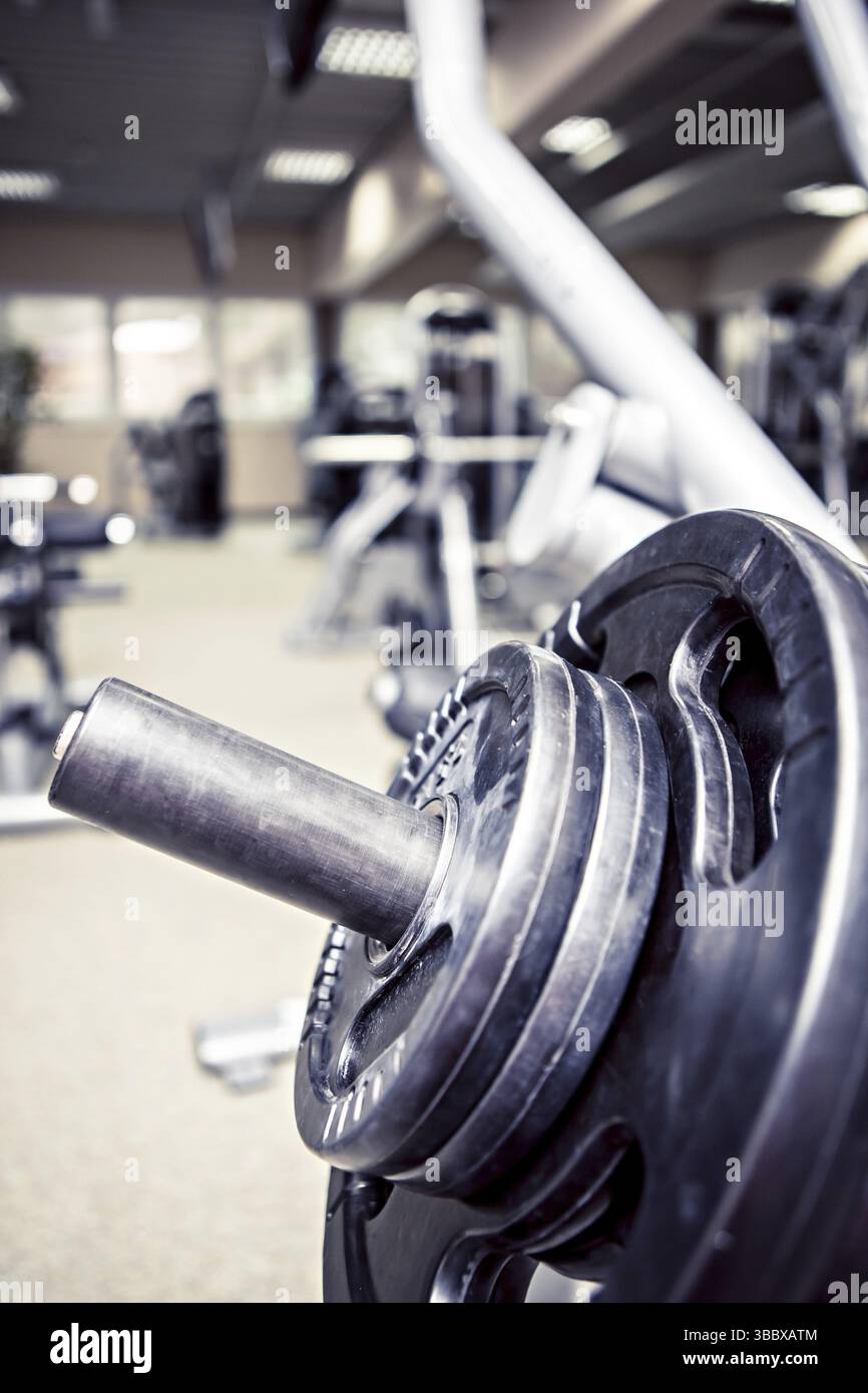 Diverse equipment and machines at the gym room Stock Photo - Alamy