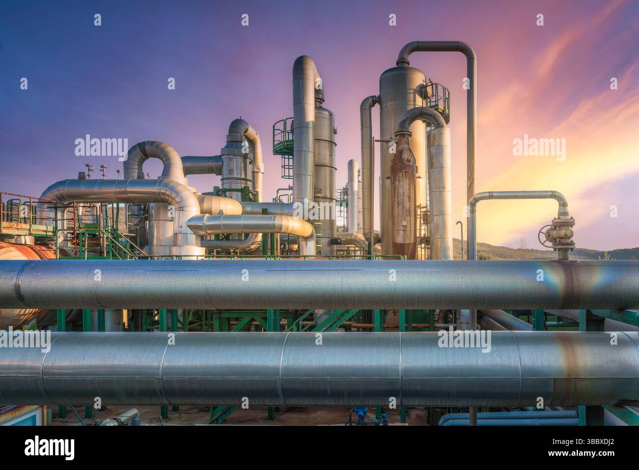Pipeline of a geothermal power plant at sunset in Larderello, Tuscany ...