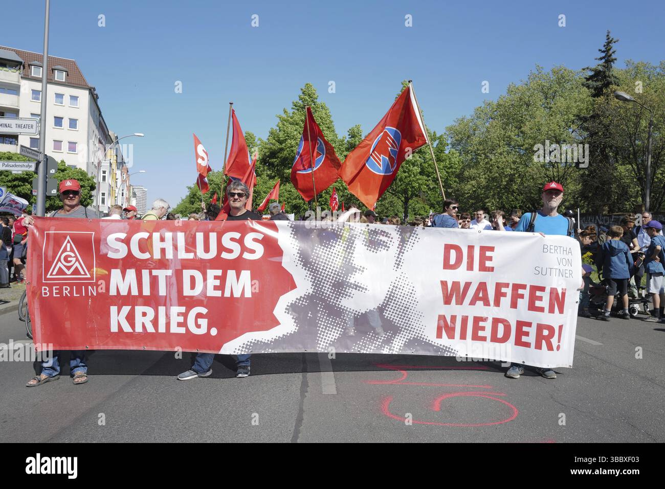 A huge banner held aloft by protesters demanding an end to war during ...