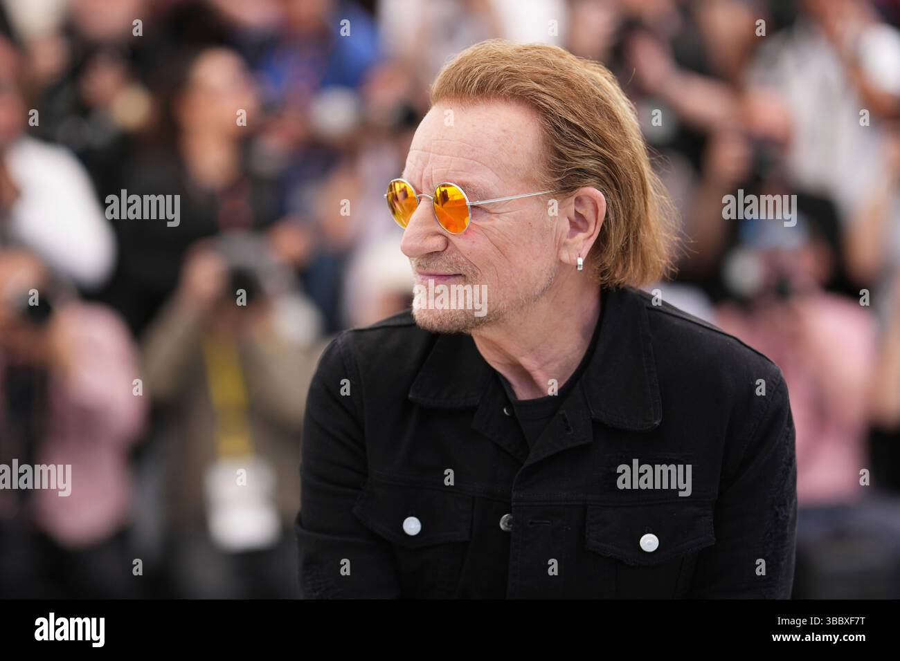 Bono poses for photographers at the photo call for the film 'Bono' at ...
