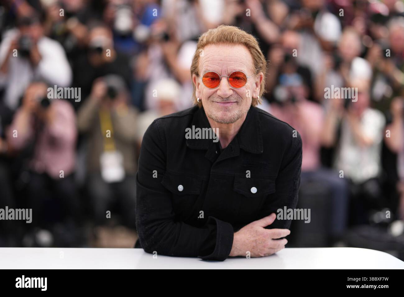 Bono poses for photographers at the photo call for the film 'Bono' at ...