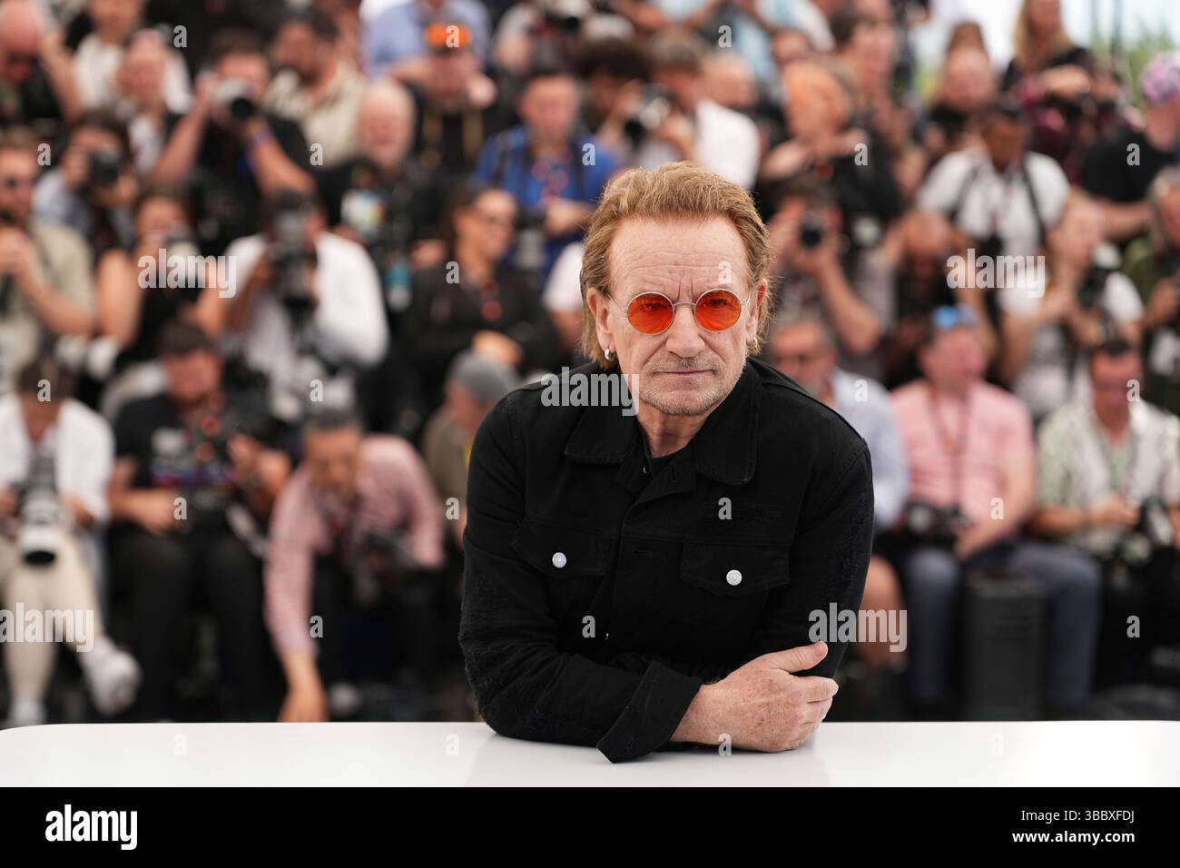 Bono poses for photographers at the photo call for the film 'Bono' at ...