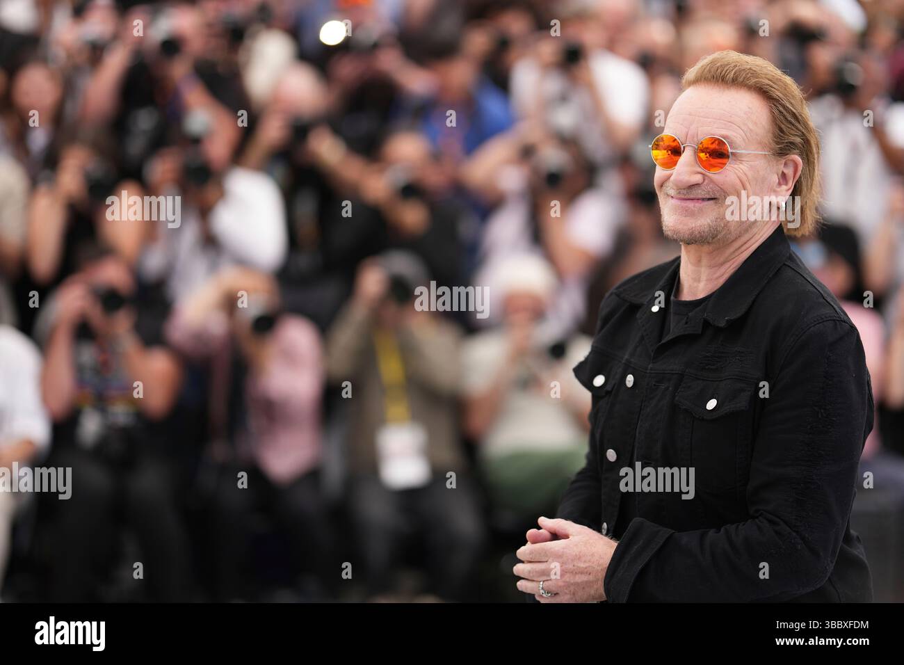 Bono poses for photographers at the photo call for the film 'Bono' at ...