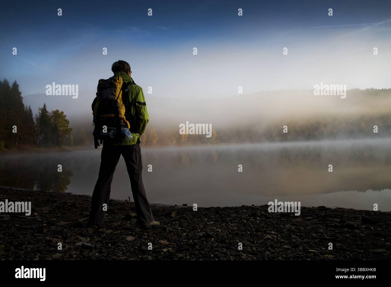 Scenes of hiking in the wild. Early in the morning at a lake Stock ...